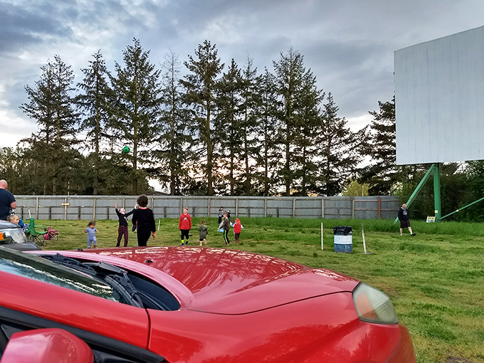 Between features, kids reclaim their natural habitat&mdash;open space&mdash;turning the grassy area into their own impromptu playground.
