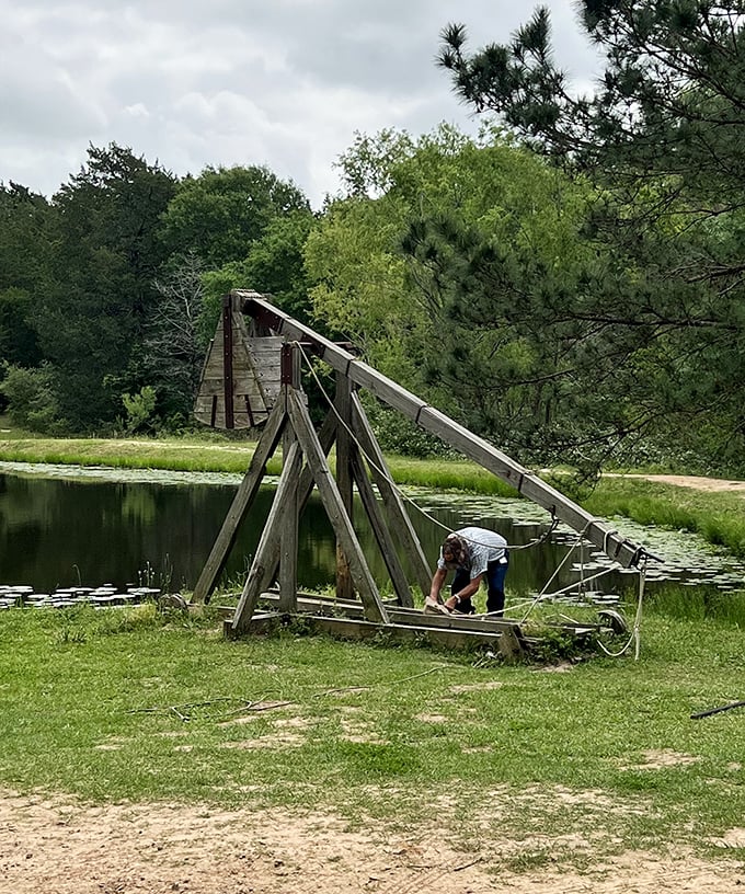 This full-sized trebuchet demonstrates medieval siege warfare technology with impressive engineering and historical accuracy.