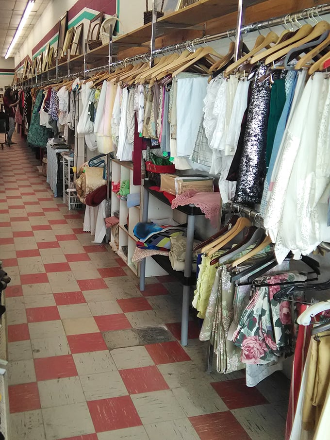 Delicate linens and vintage fabrics hang like textile treasures, each with stories woven into their threads.