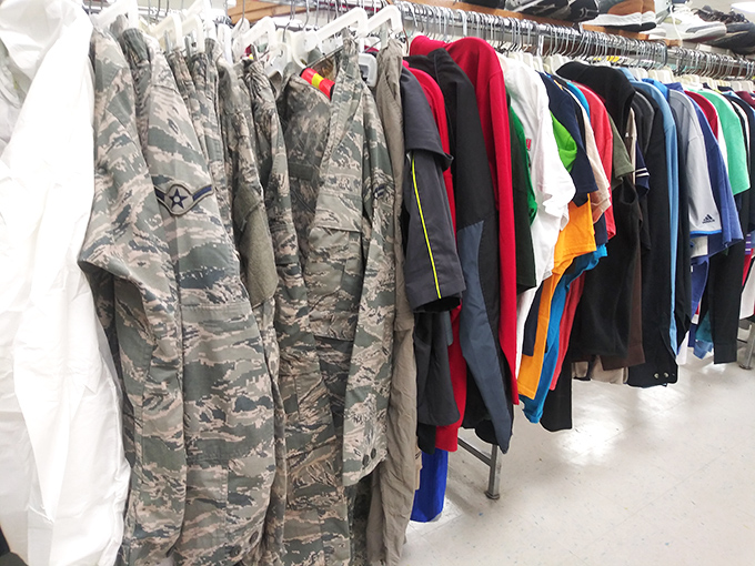 Military uniforms alongside everyday attire—a fashion democracy where service wear and casual clothes share the same dignified rack.