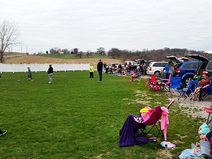 Families claim their territory with colorful chairs and blankets, creating little islands of comfort before the feature presentation begins.