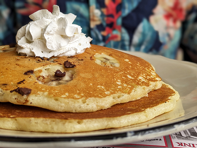 These pancakes aren't just breakfast, they're an event &ndash; fluffy golden discs studded with chocolate chips and crowned with a cloud of whipped cream.