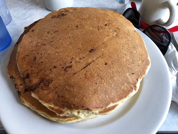Pancakes so fluffy they could double as pillows. The only thing missing is a warning sign: "May induce immediate food coma."