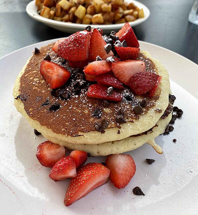 These pancakes don't just come with strawberries and chocolate chips&mdash;they showcase them like jewelry. Breakfast that doubles as an Instagram celebrity waiting to happen.