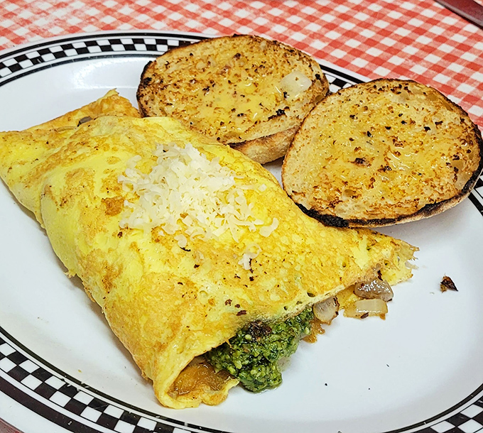 This isn't just an omelet&mdash;it's a love letter to breakfast, folded perfectly around vibrant pesto and served with English muffins toasted to golden perfection. 