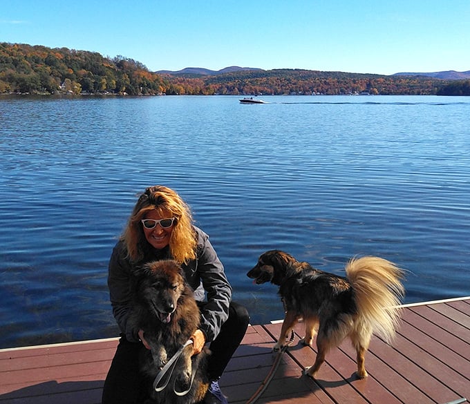 The lake makes everyone smile, even four-legged visitors. Dogs know what humans sometimes forget&mdash;water views are always better with a friend.