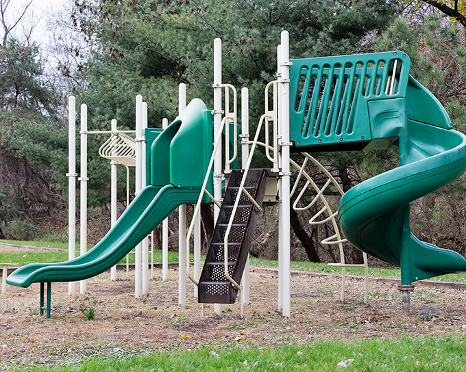 This playground might not have the latest bells and whistles, but those slides have launched generations of giggling children into summer memories.