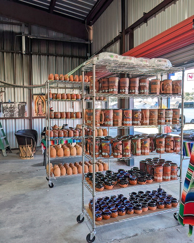 Terra cotta pottery stacked high like an earthenware enthusiast's fever dream come wonderfully true here.
