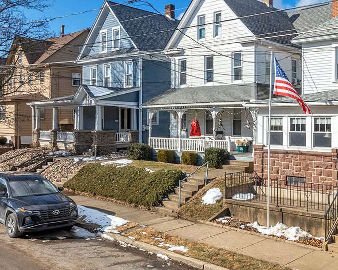 Classic American homes with front porches made for actual sitting, not just staging for real estate photos.