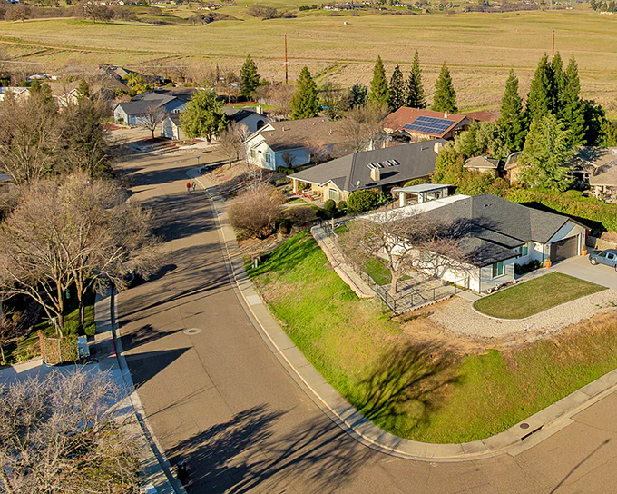 Spacious lots and modest homes define Red Bluff neighborhoods, where retirement dollars stretch further than your morning walk through these peaceful streets.