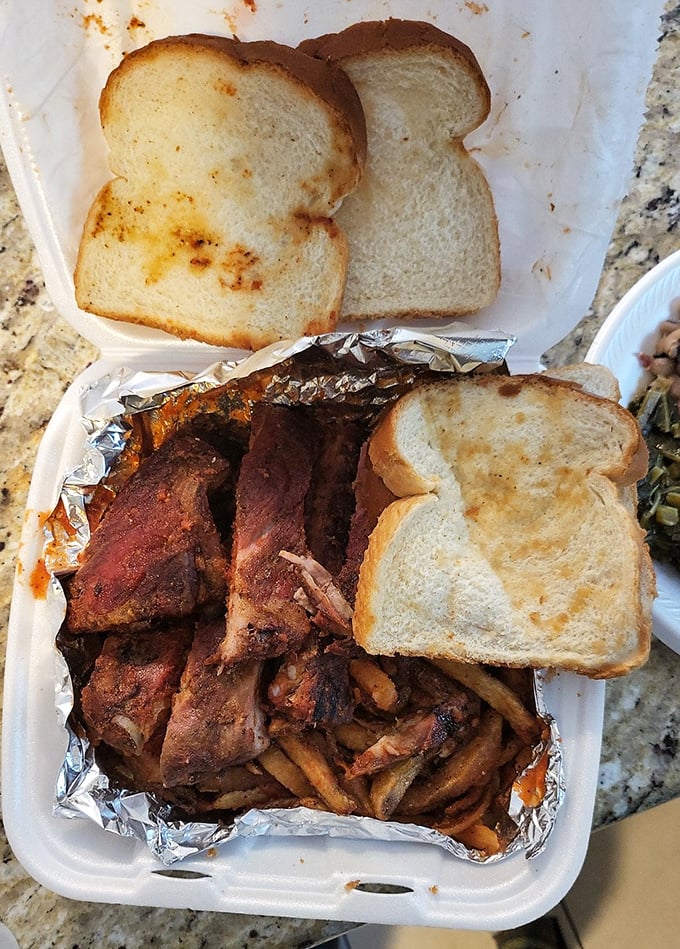 Barbecue architecture at its finest&mdash;layers of smoky ribs and fries that make you forget your table manners exist.