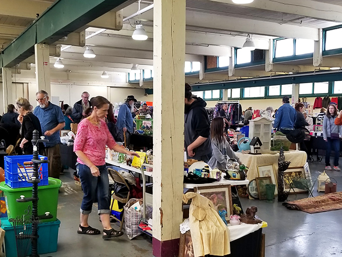The weekend ritual unfolds as shoppers scan tables with the focus of archaeologists on a promising dig. The thrill of discovery hangs in the air.