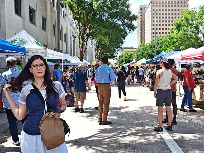 The market's true magic lies in these moments—strangers becoming temporary neighbors as they navigate the culinary treasure hunt beneath downtown's watchful skyscrapers.