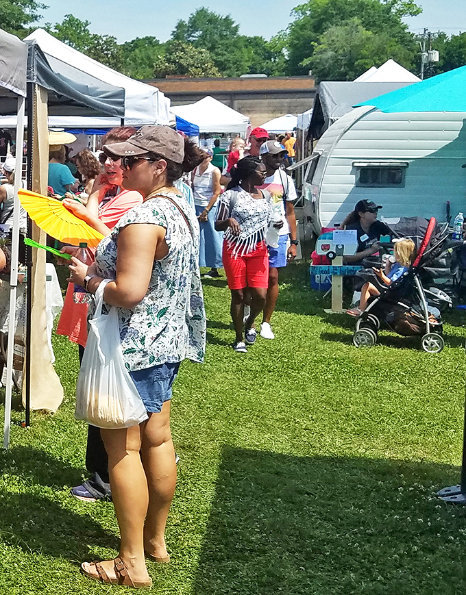 Serious shoppers navigate the market with practiced precision, shopping bags already full by mid-morning. The white plastic bag&mdash;Canton's version of a designer tote.