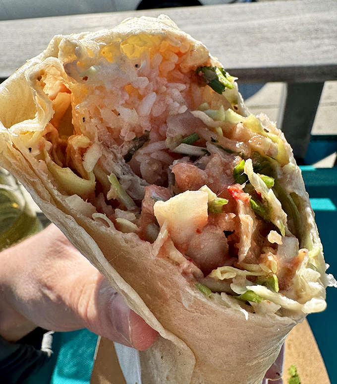 This isn't just a burrito—it's an architectural marvel of perfectly proportioned fish, cabbage, and that legendary Spencer Sauce.