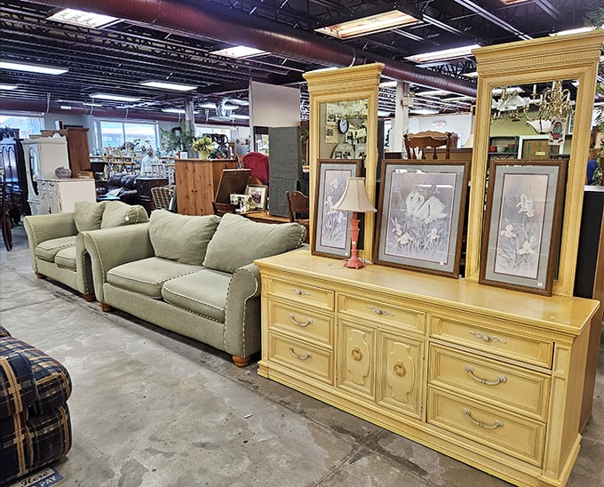 The perfect pairing: a sage green sofa set with a buttery yellow dresser. Someone's living room makeover is waiting to happen right here.