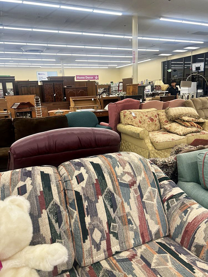 The sofa section resembles a living room time capsule, where Southwestern patterns meet floral upholstery in a comfortable conversation across decades.