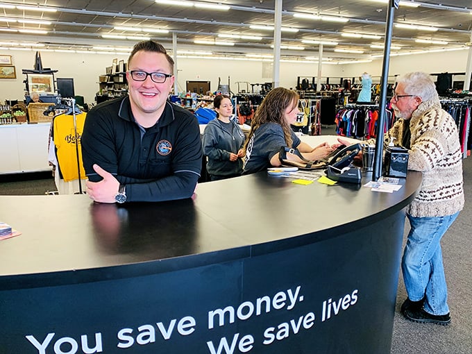 The checkout counter's message says it all: your bargain hunting directly supports life-changing opportunities for others.