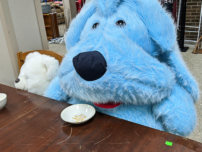 This giant blue dog has seen things. Now he waits patiently for a new home, perhaps as the mascot for your next Zoom meeting background.