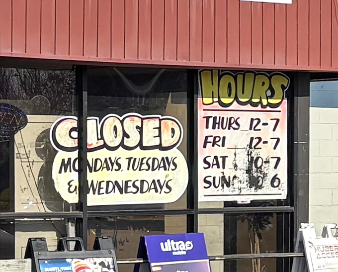 The swap meet's hours posted with no-nonsense clarity. Closed Monday through Wednesday—even treasure hunters need to rest sometimes.