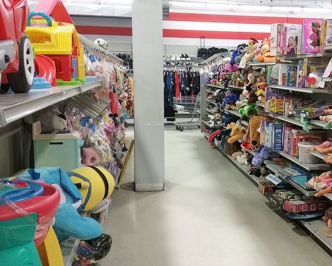 Toy trucks, action figures, and childhood memories line these shelves like a museum dedicated to playtime across the generations.