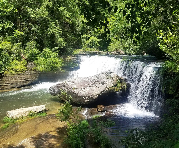 Water dancing over ancient stone &ndash; this cascade creates nature's perfect white noise machine for stressed-out modern souls.