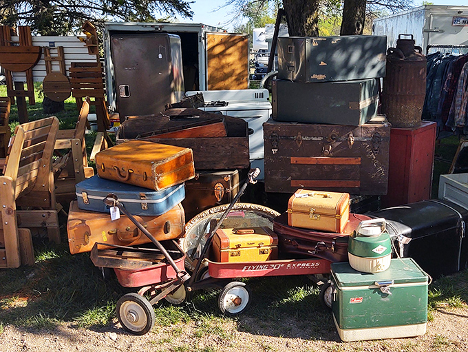 Vintage suitcases stacked like a time-traveler's luggage cart. Each one could tell stories of vacations past and roads less traveled.