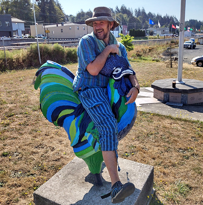 Some visitors can't resist hamming it up with the colorful rooster sculptures that complement Winlock's egg-centric claim to fame.