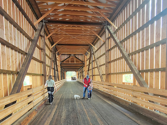Dog walkers and cyclists share the wooden planks, proving this historical treasure remains as functional as it is beautiful.
