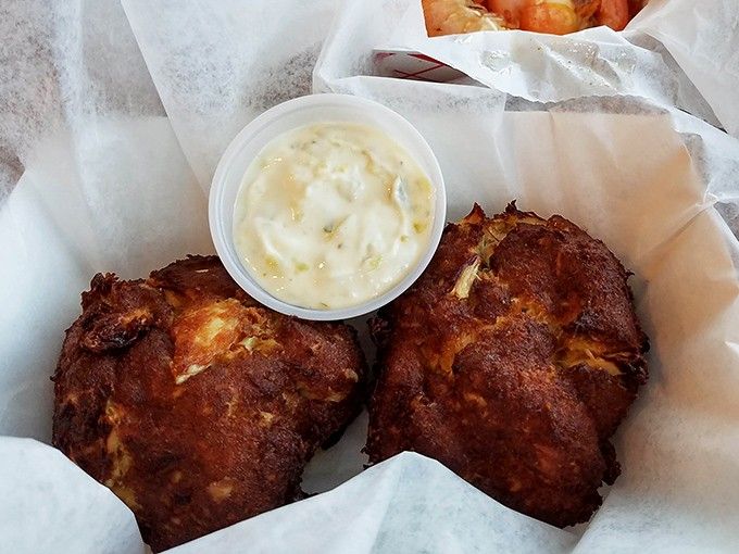 Golden-brown crab cakes that would make a Baltimore native weep with joy, proving distance from the coast means absolutely nothing.