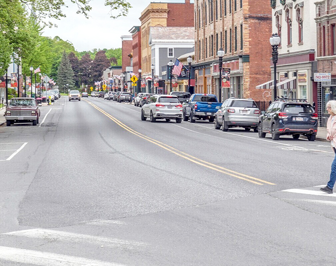 Adams' historic mill buildings frame the flowing river, a daily nature show that costs absolutely nothing to enjoy.