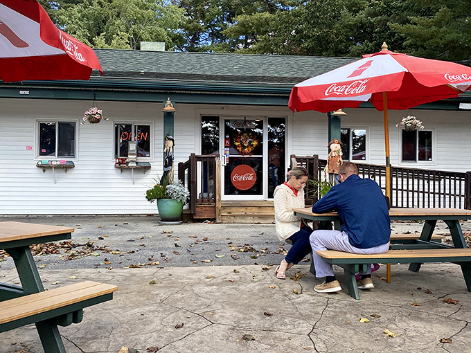 Bentley's white cottage vibe creates the perfect summer escape. Those red umbrellas practically whisper "come, relax, and bite into something wonderful."