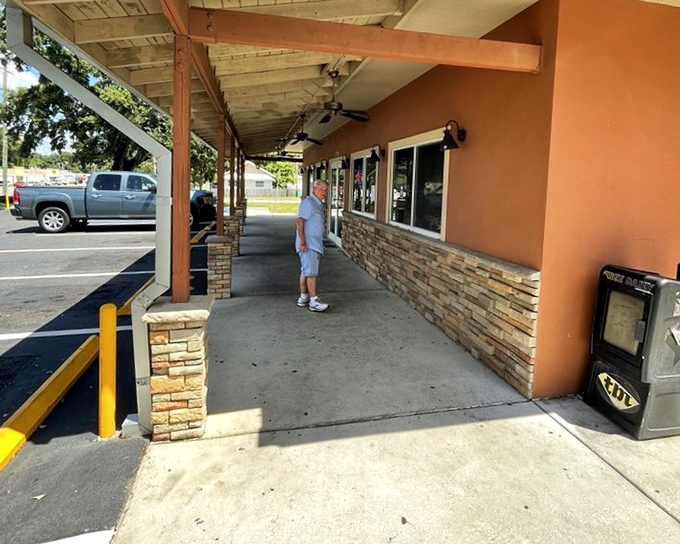 Big John's covered walkway leads to barbecue heaven. Simple exteriors often hide the most extraordinary smoke-kissed delights.