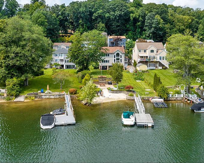 This lakefront paradise in Brookfield makes you wonder why anyone would choose concrete over this liquid gold view.