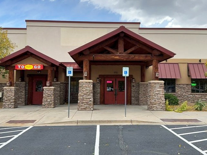 Captain Hook's rustic lodge exterior hides a seafood surprise&mdash;this ain't your typical log cabin experience, unless your cabin comes with crab legs.