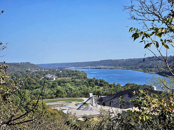 A sweeping view of the Ohio River near Madison, Indiana, with rolling hills and the Milton&ndash;Madison Bridge in the distance.
