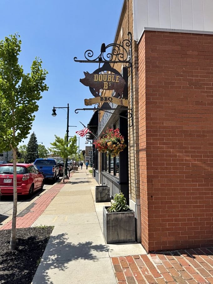 That pig sign hanging over the sidewalk isn't just cute &ndash; it's a promise of pork perfection waiting inside.