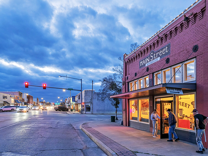 Durant's revitalized downtown district blends modern storefronts with historic architecture under the watchful gaze of traffic lights and Oklahoma skies.