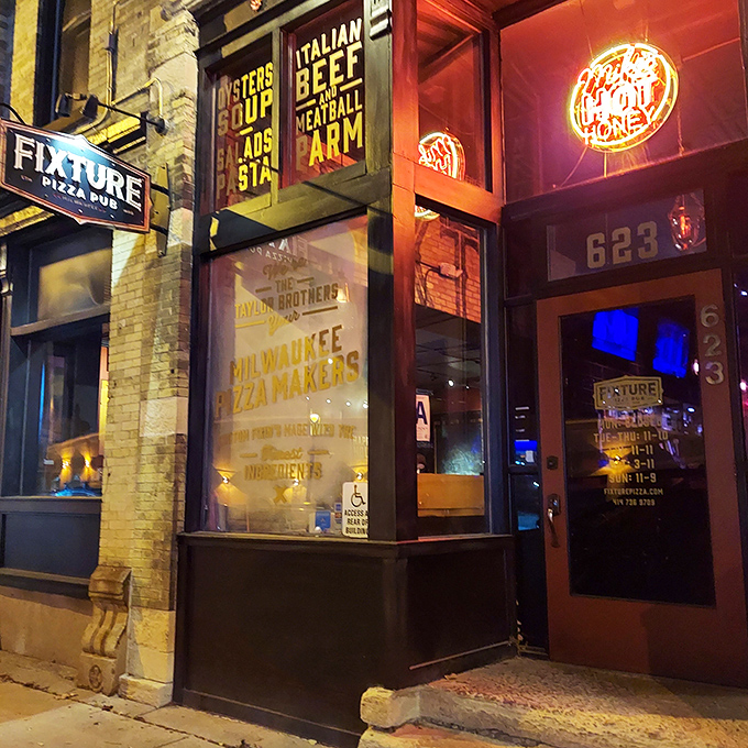 Fixture's vintage-cool storefront whispers of pizza secrets within. Industrial chic meets Italian heat!