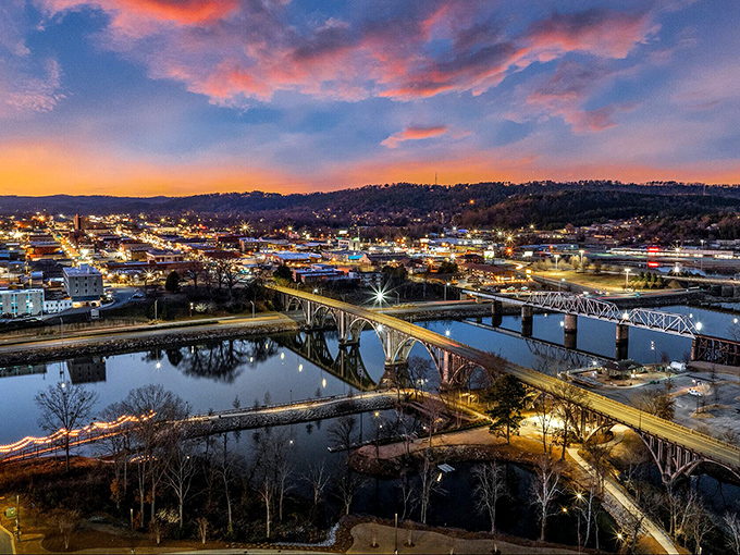 Gadsden's bridges span the Coosa River under dramatic skies, connecting affordable neighborhoods with stunning natural beauty.
