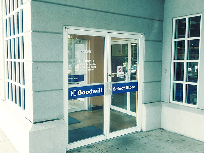 Goodwill's sleek entrance is the portal to bargain paradise. Behind those glass doors, fashion treasures await at prices that seem almost illegal!
