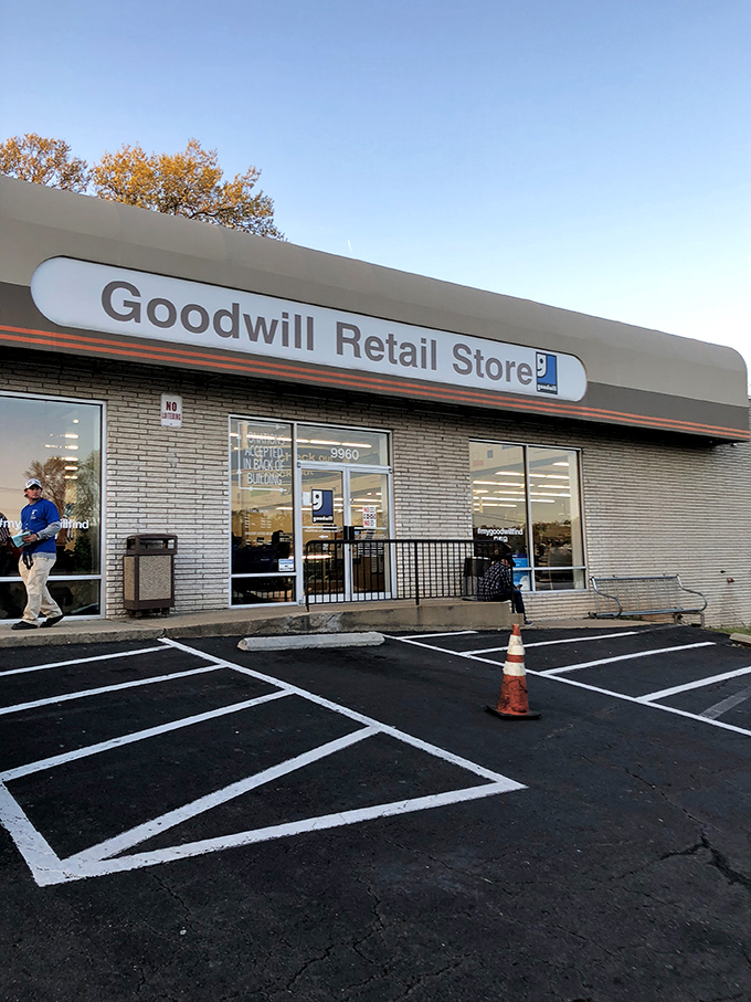 Donation destination! This bright Goodwill welcomes both givers and seekers under clear blue skies, with helpful instructions right on the windows.