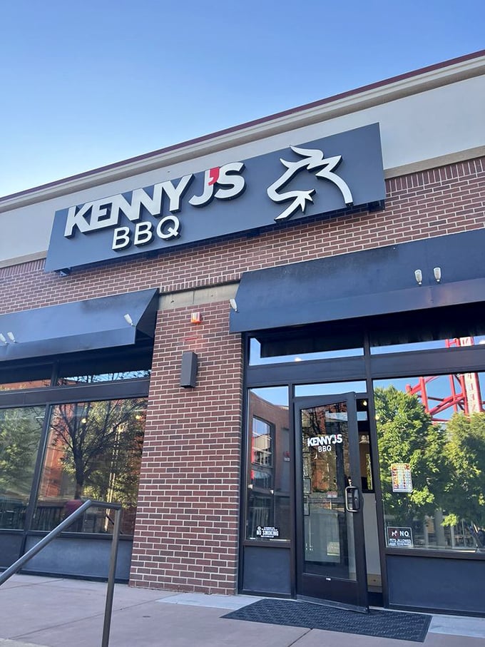 Kenny J's contemporary brick facade means business. Behind those doors, brisket dreams come true while mountains stand guard.