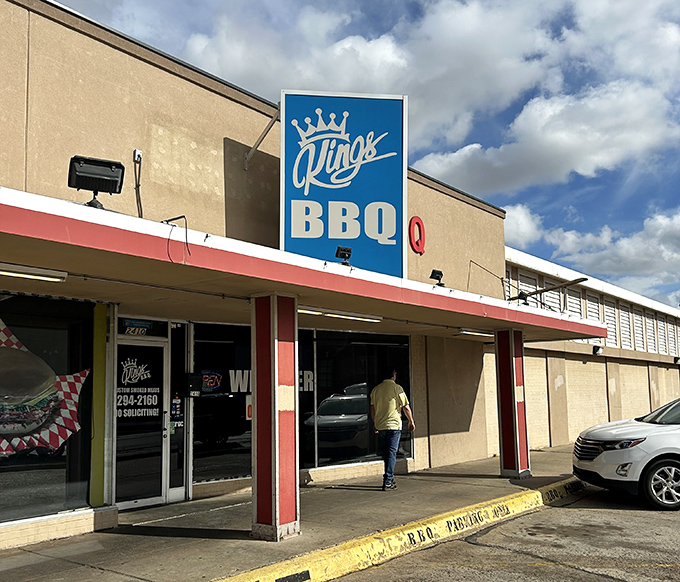 King's BBQ's bold blue sign stands out like a royal decree: "Thou shalt enjoy extraordinary barbecue here!"