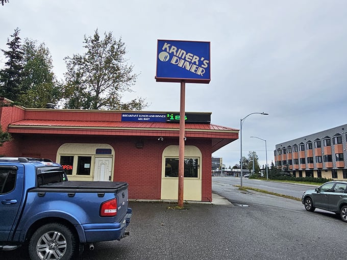 Kriner's bold blue sign stands out like a beacon for hungry travelers seeking authentic diner fare in the heart of Anchorage.