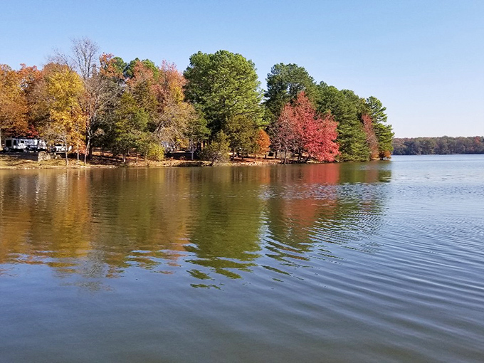 Fall's fiery display reflects perfectly in these calm waters, creating nature's most spectacular mirror.