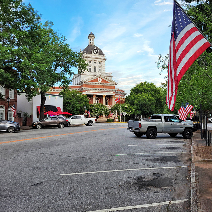 Madison's courthouse stands proud against blue skies, where American flags flutter like a Norman Rockwell painting come to life.