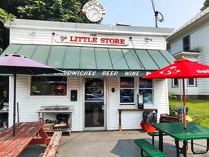 The Little Store's vintage sign and picnic tables promise the kind of sandwich experience Norman Rockwell would have painted.