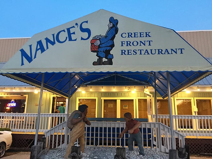 Nance's blue awning and wooden fishermen statues set the perfect creek-front scene. Where hushpuppies are considered their own food group.