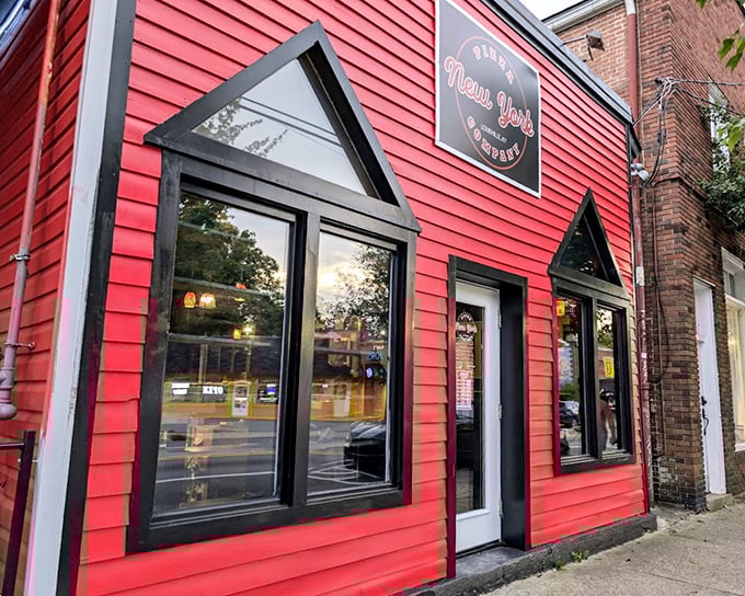 New York Pizza Company's bold red building with distinctive triangular windows makes a statement as bright as its flavors.